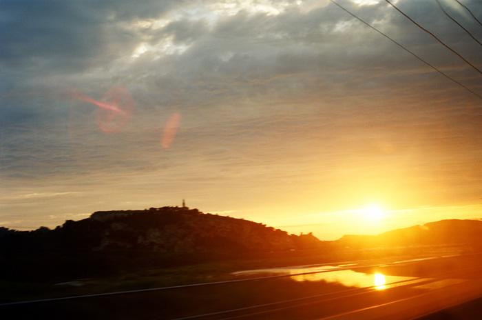 On My Way: Sunset through a train window
