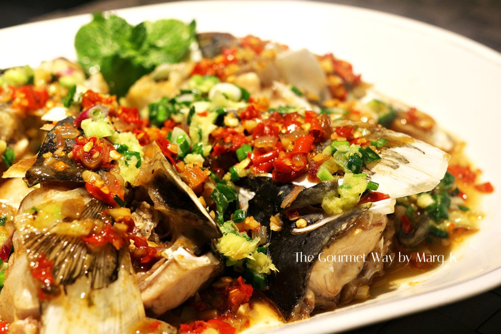 Steamed Fish Head with Homemade Chopped Chili Pepper Sauce . 自家剁椒蒸魚頭