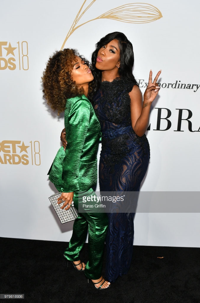 Ladies in Satin Blouses: Serayah McNeill - green satin suit