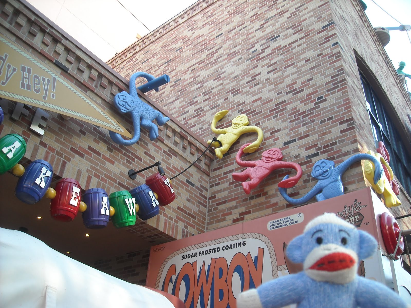 Sock Monkey goes to Disney World: Monkey see, monkey do.