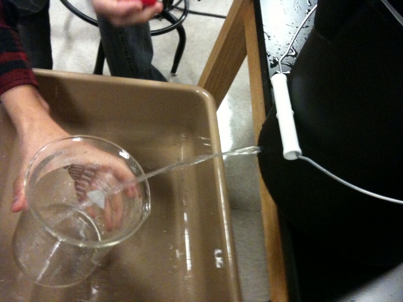 Physics 4C erbessette: Fluid Dynamics (Flow of water out of bucket)