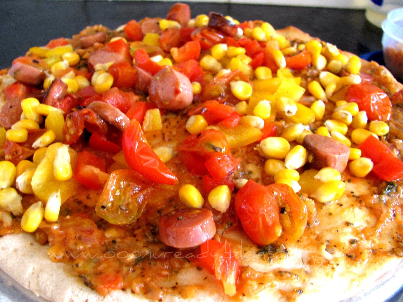 Oonu ready: Mutton Pizza with Corn, Cherry Tomatoes and Sausages