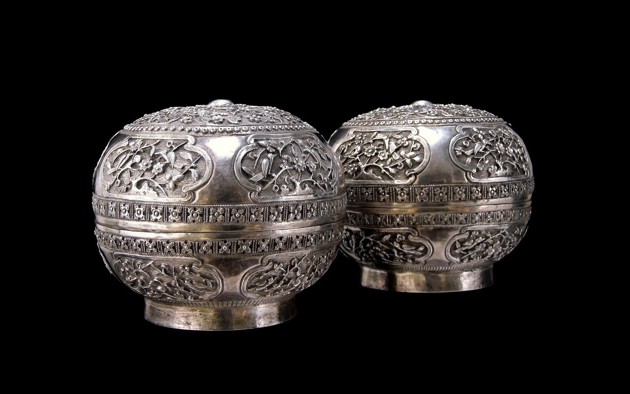 PATINA CINA PERANAKAN: PAIR STRAITS CHINESE SILVER REPOUSSE BETEL NUT BOXES