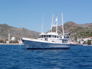 Envoy In The Med: Envoy anchored off Bozburun with mosque in background