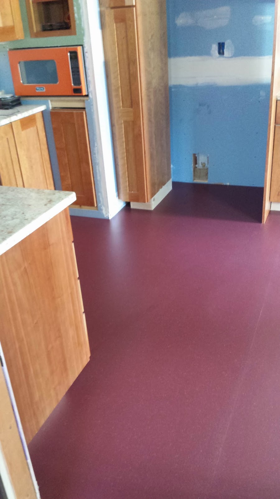 One Step Further: Kitchen Installed with Marmoleum Piano, School Red #3638
