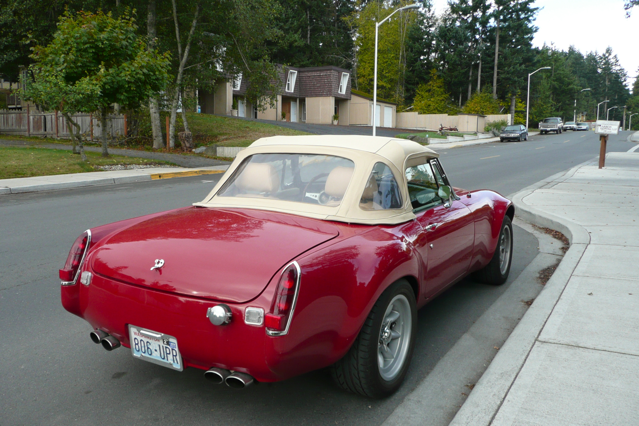 OLD PARKED CARS.: 1970 MG MGB custom...V8?