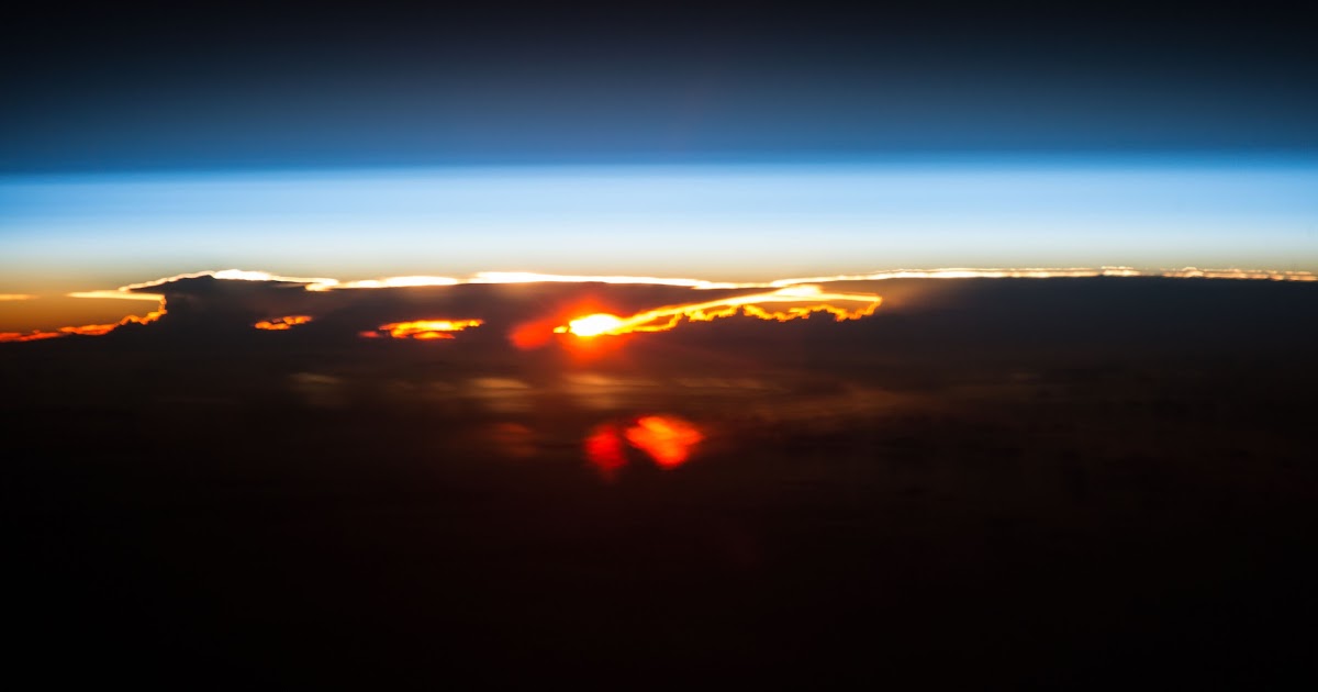 Sun, Earth's Atmosphere and Clouds over Pacific Ocean seen from the ...