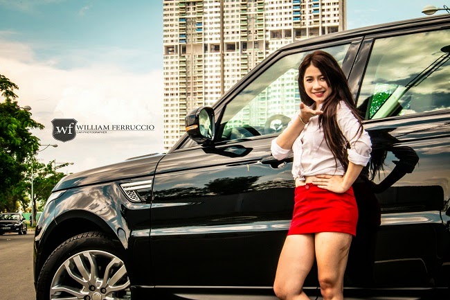 Rebellion office girl poses with Range Rover Sport | Carsfresh