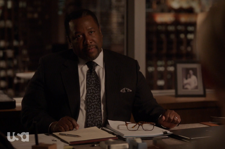 Harvey has words with Donna.