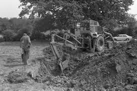 Maarakennus koneita.: Whitlock Dingum Digger