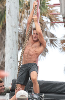 Oh my! Check out the muscle on Zac Efron on the set of Baywatch