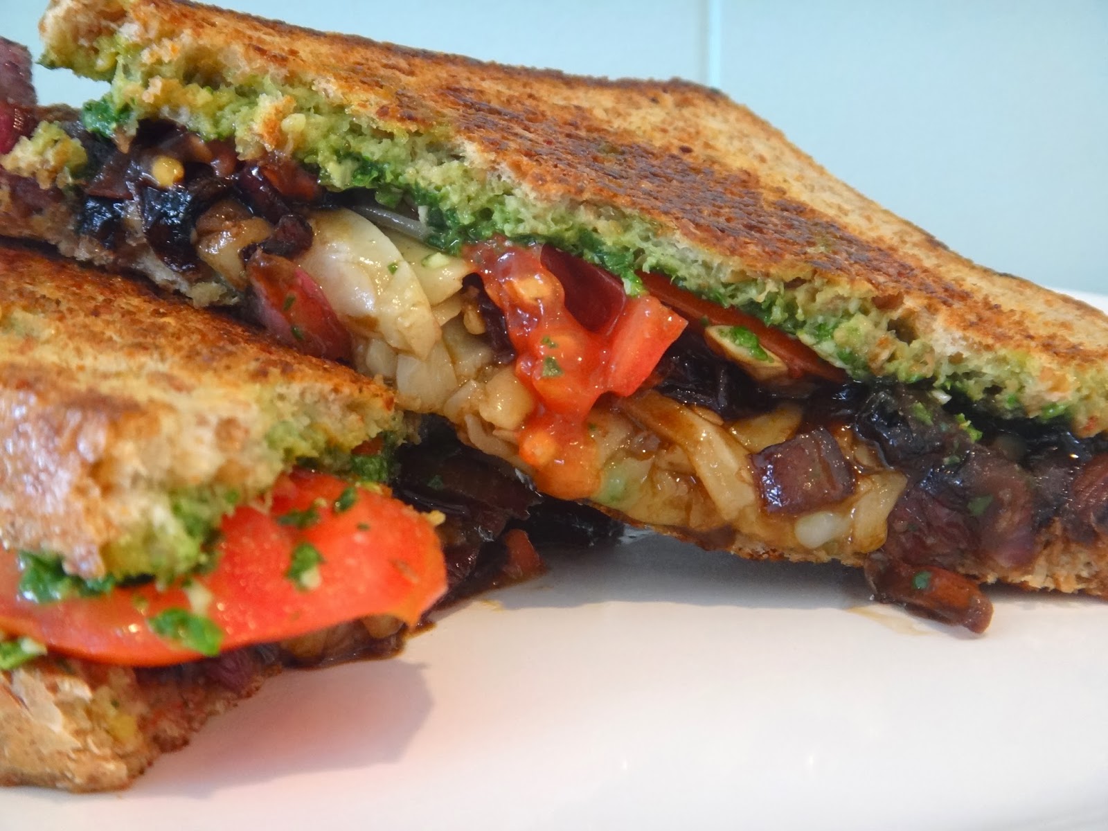 Tomato, Mozzarella and Pesto Panini with Balsamic Glazed Red Onions