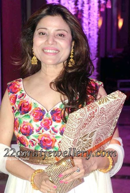 Bolly Actress in Gold Jumkis and Bangles - Jewellery Designs
