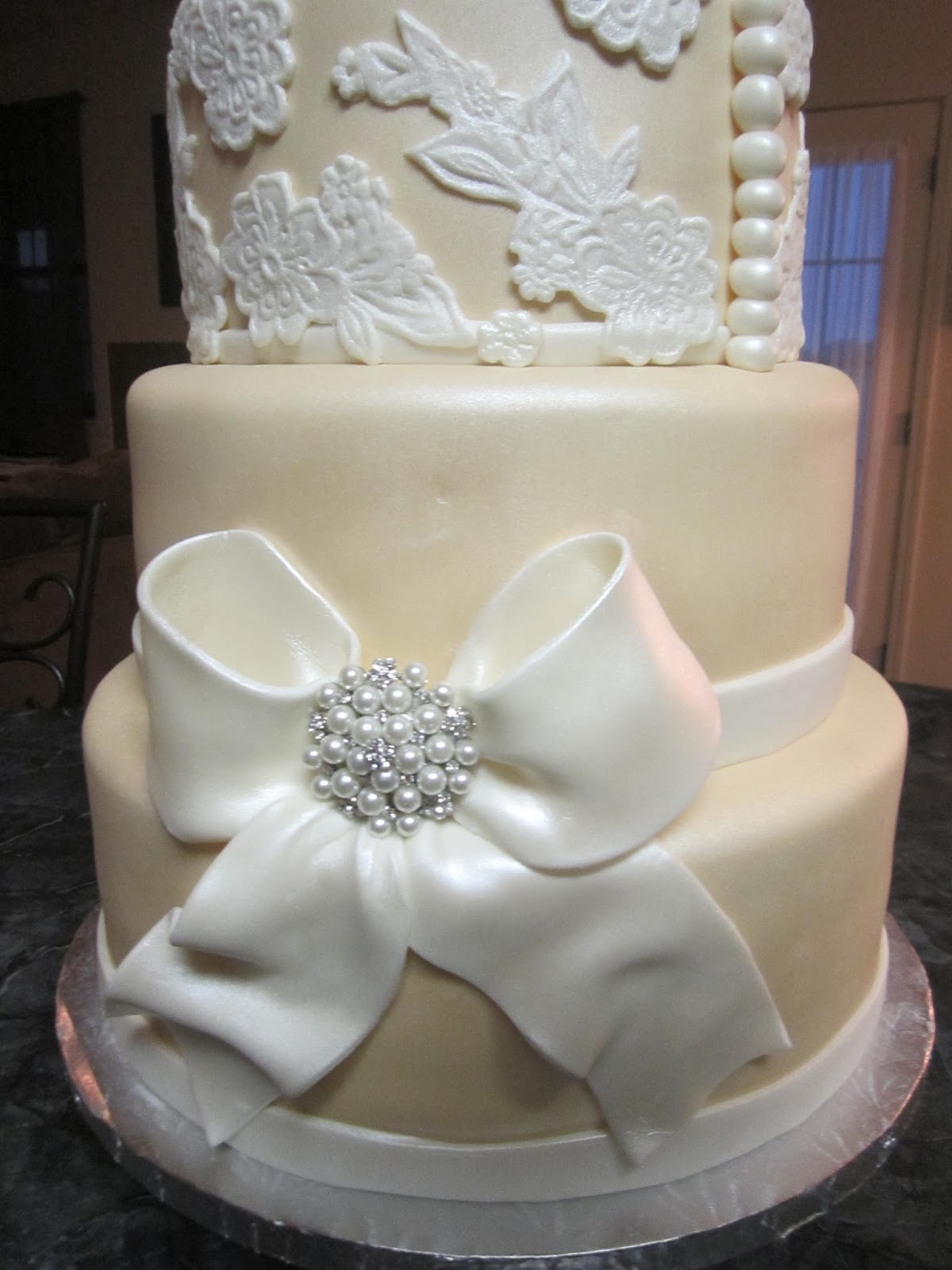MyMoniCakes: Elegant Beige Wedding Cake With Lace Accents and Bow