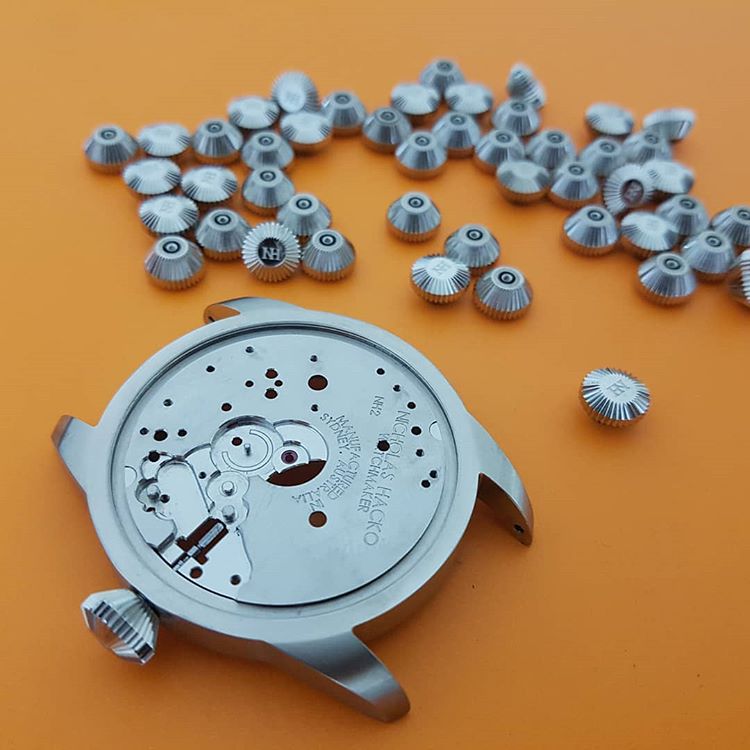 Nicholas Hacko Watchmaker: Timascus mainplate and Titanium case