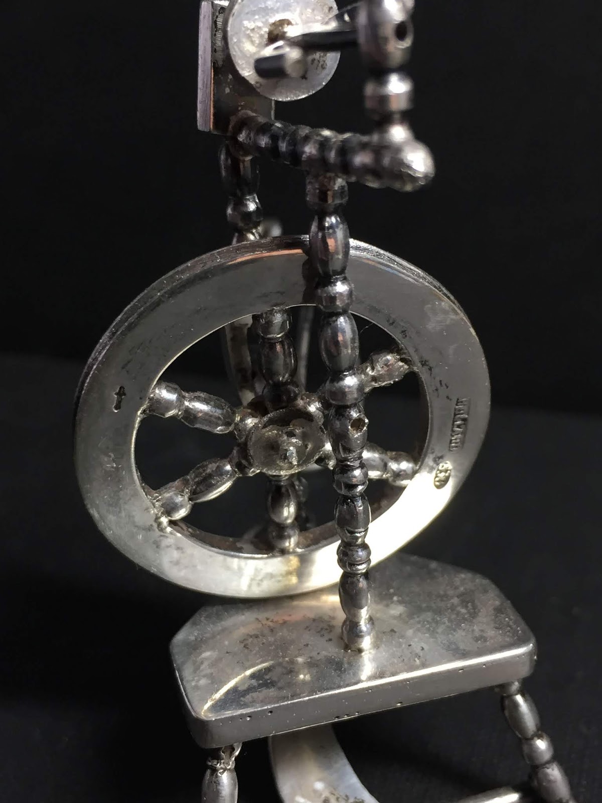 Silver spinning wheel