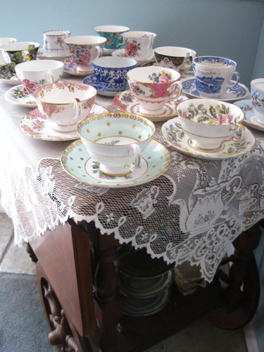 Tea With Friends: Teacups dancing on a tea trolley