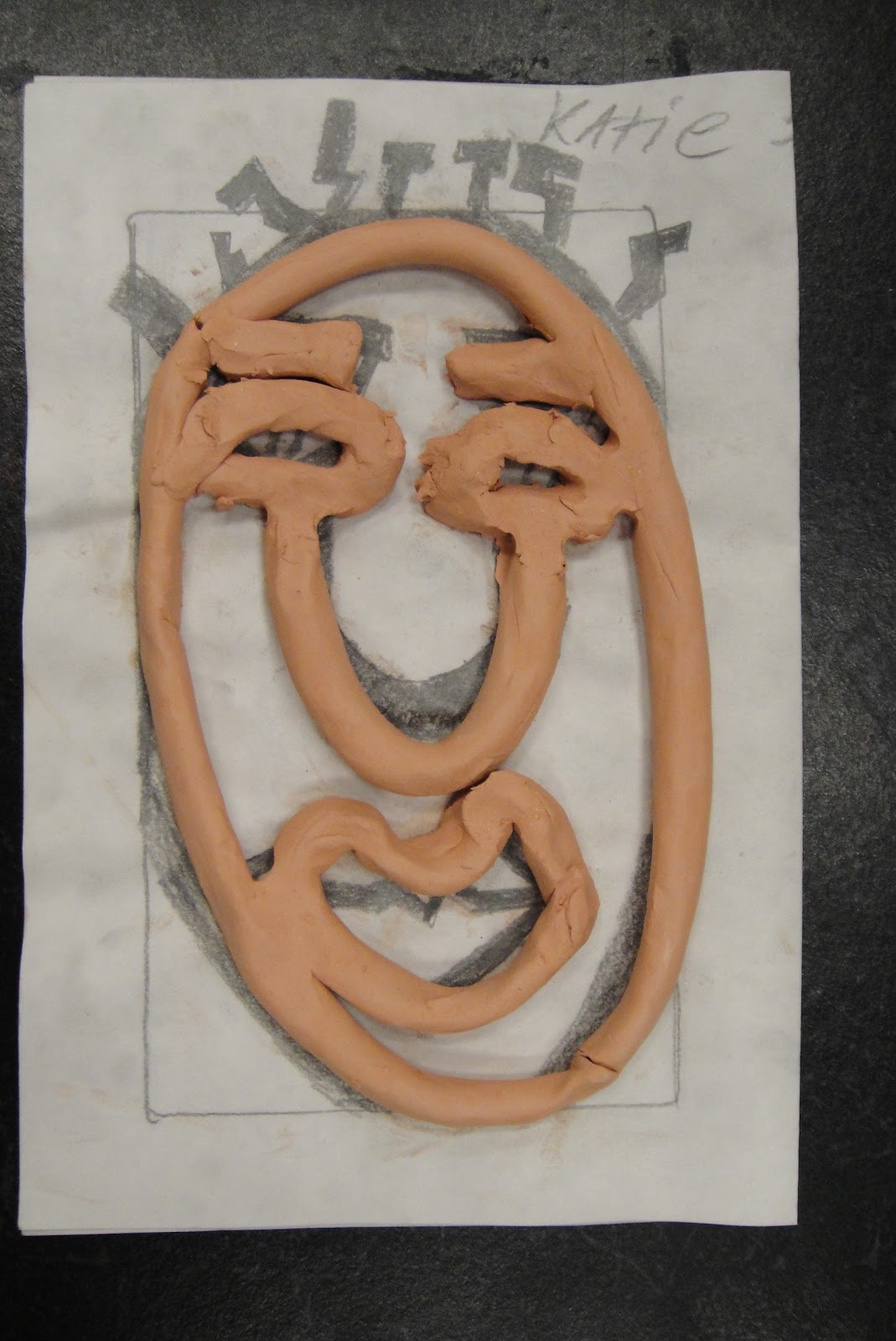 Framed in Swirly Gold: Coil Clay Faces