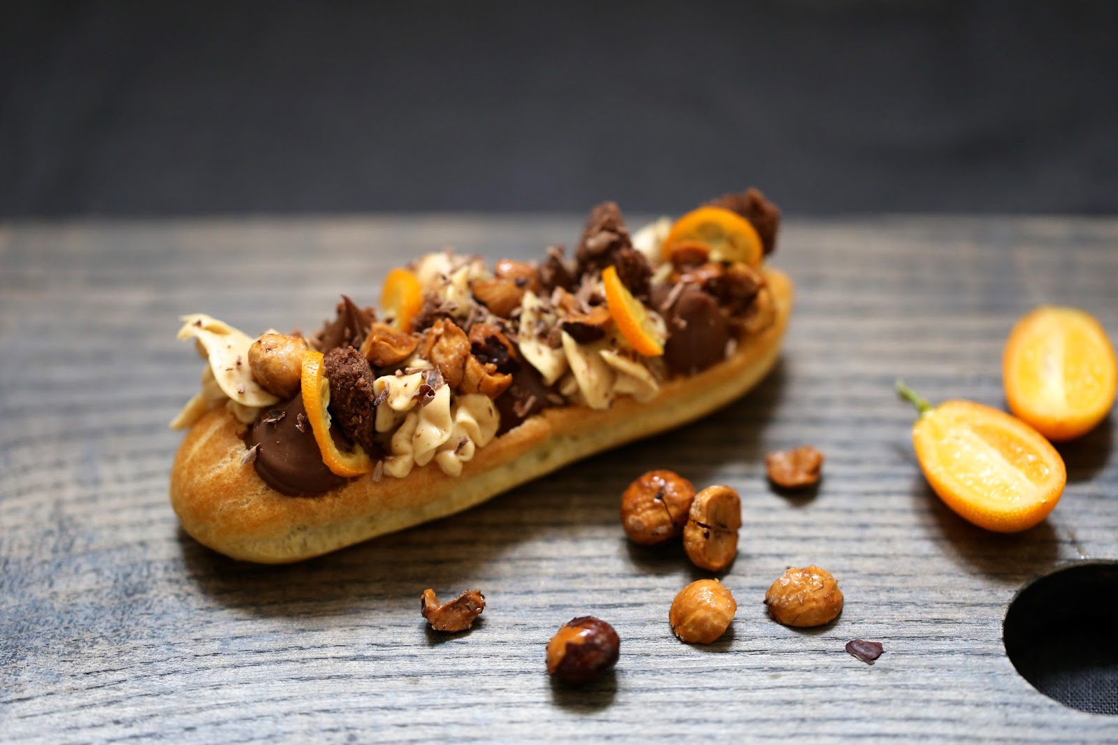 Eclair praliné , chocolat noir , streusel cacao et kumquat | On dine ...