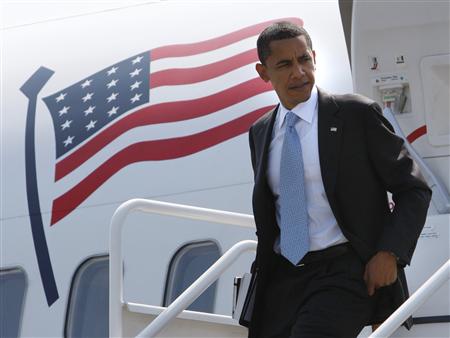 World Boat: One of us: Barack Obama alights from an aircraft