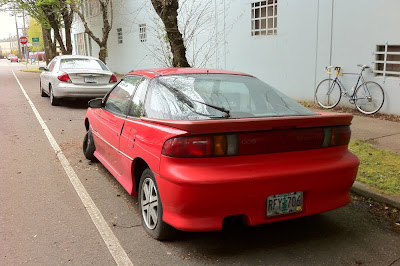 OLD PARKED CARS.: 1990 Geo Storm GSi.