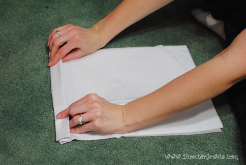 3. Once all layers are folded, you will have one long strip. Smooth out ...