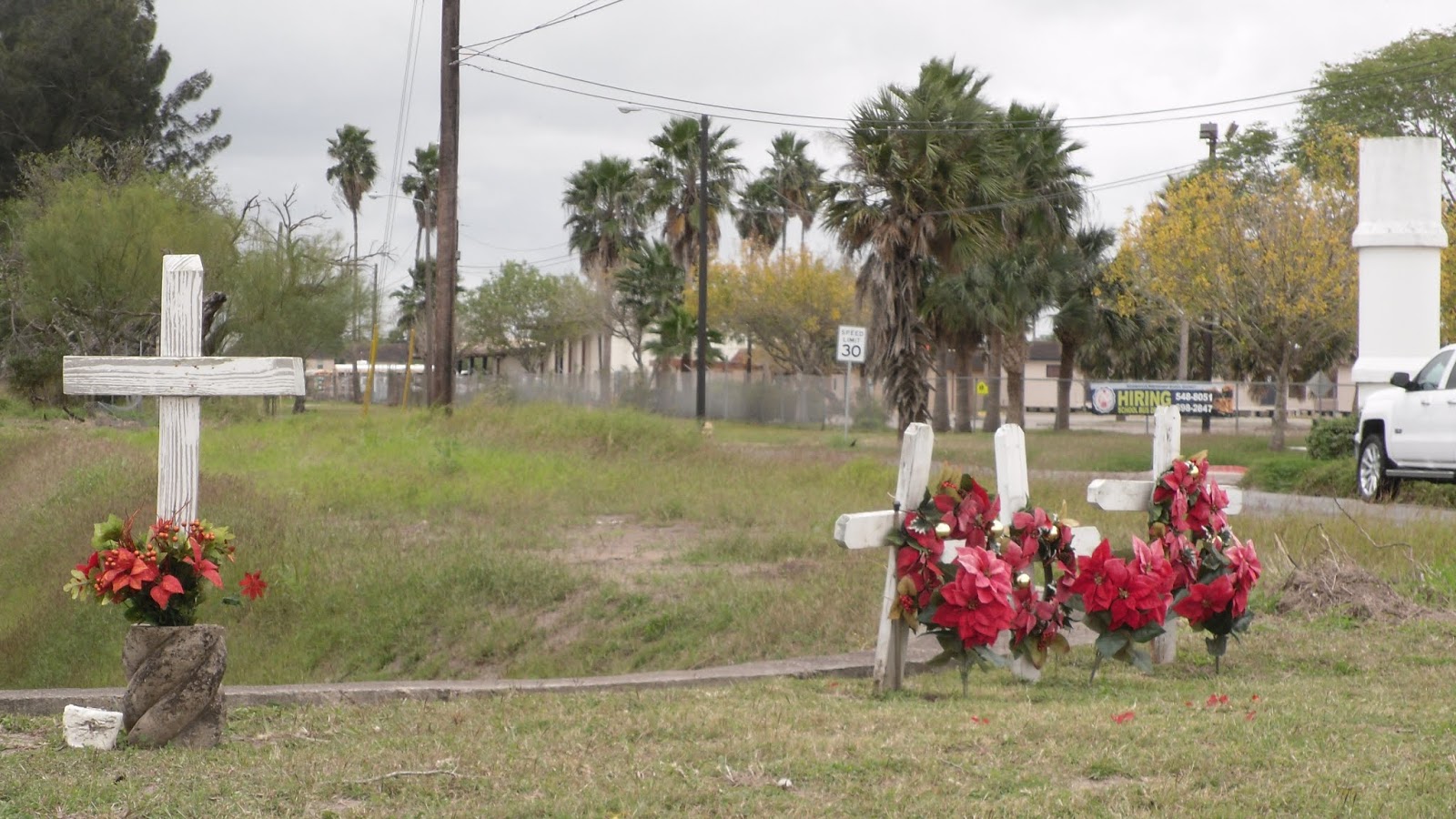 EL RRUN RRUN: POIGNANT ROADSIDE MEMORIAL W-WREATHS AND ORNAMENTS