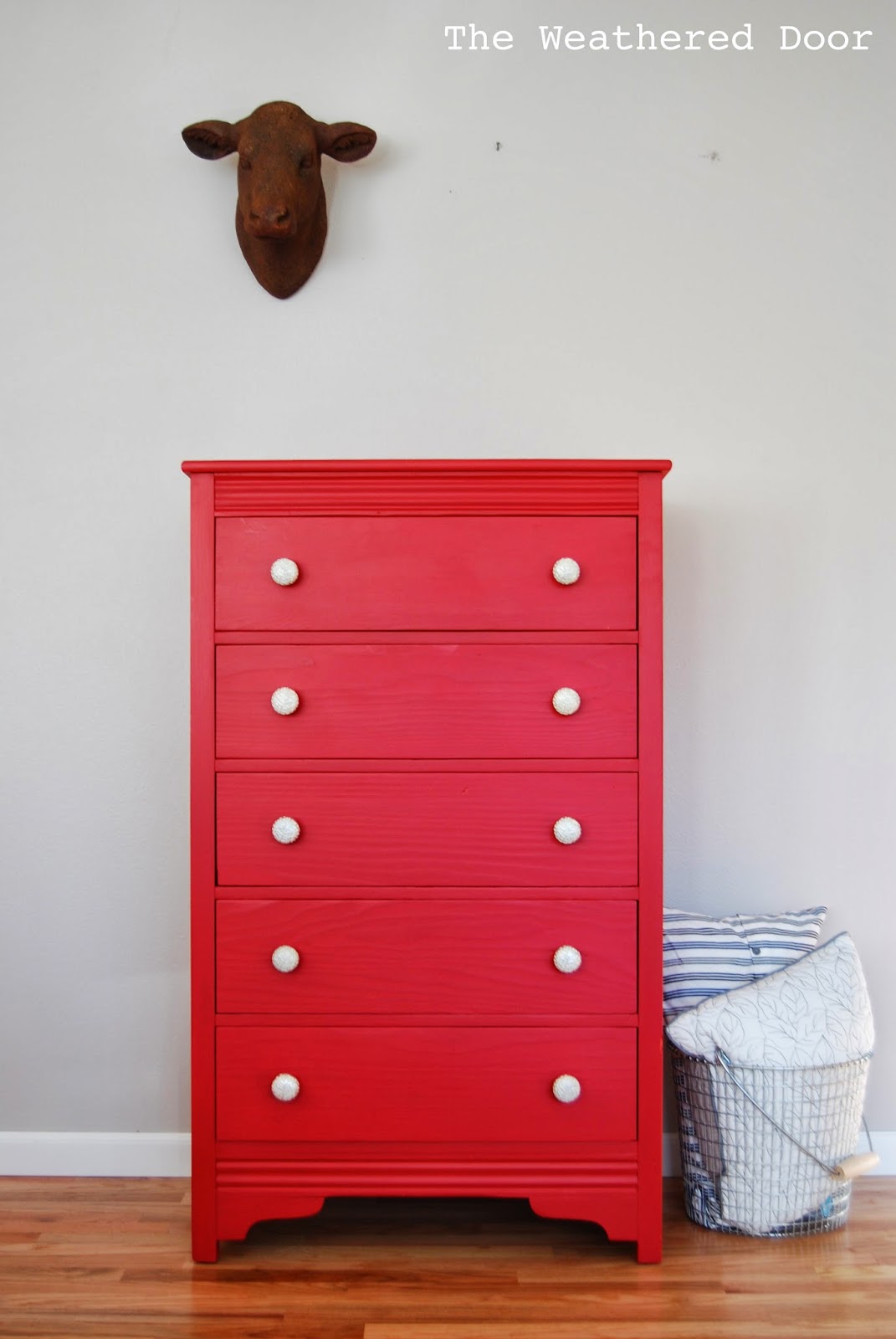 A tall red dresser with silver and white knobs - The Weathered Door