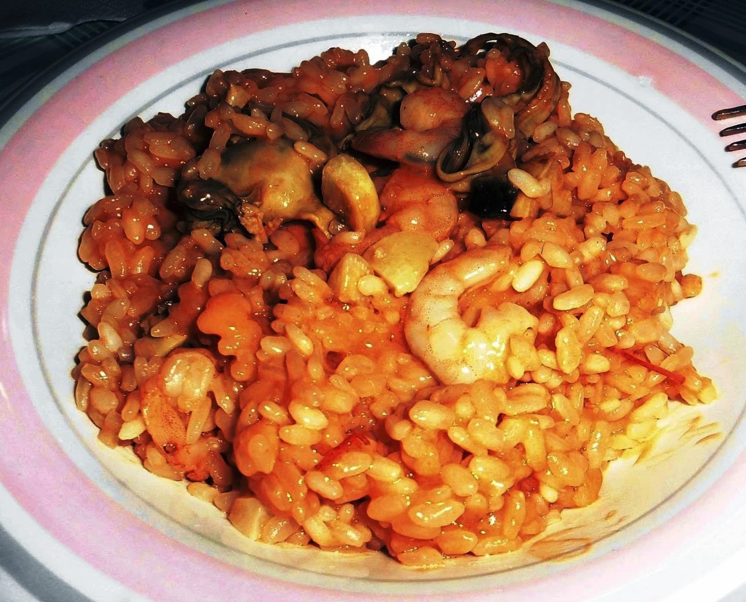 Calle Ancha: Arroz en salsa de carabineros, gambas y almejas