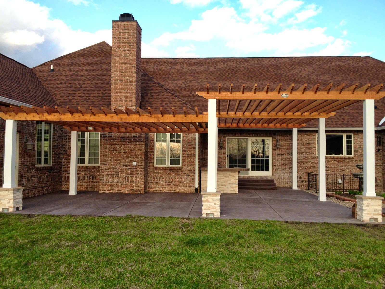 Outdoor Living: Custom bi-level pergola with stone bases, walnut ...