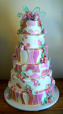 OohLaLa cakes: Multi-layered cake with pink decorations