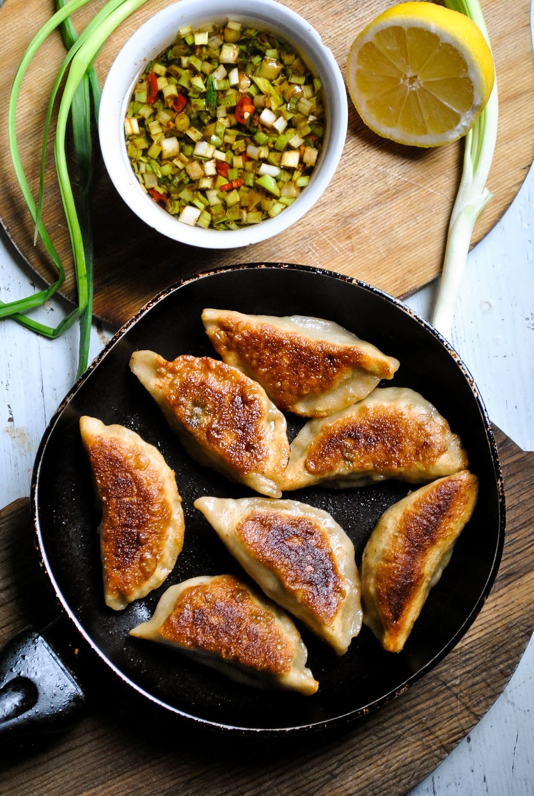 Crispy pot stickers (Chinese dumplings) with spicy mushroom and spinach ...
