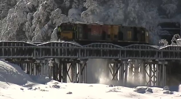 TISOTIT: Spectacular Footage of Train Plowing Through Deep Snow