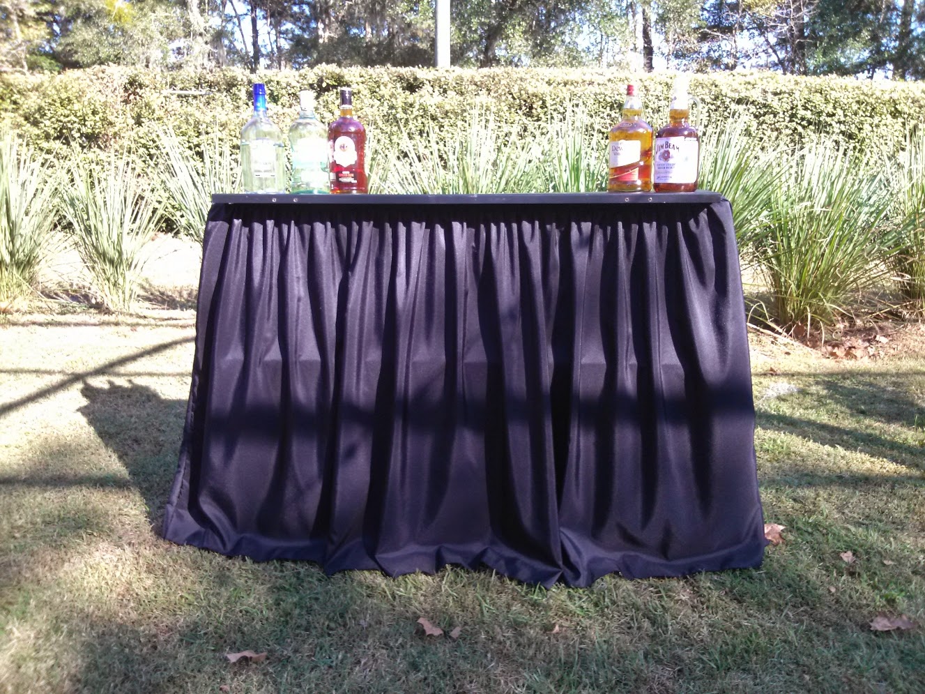 Your One Stop Shop: Portable Bar with black skirt.