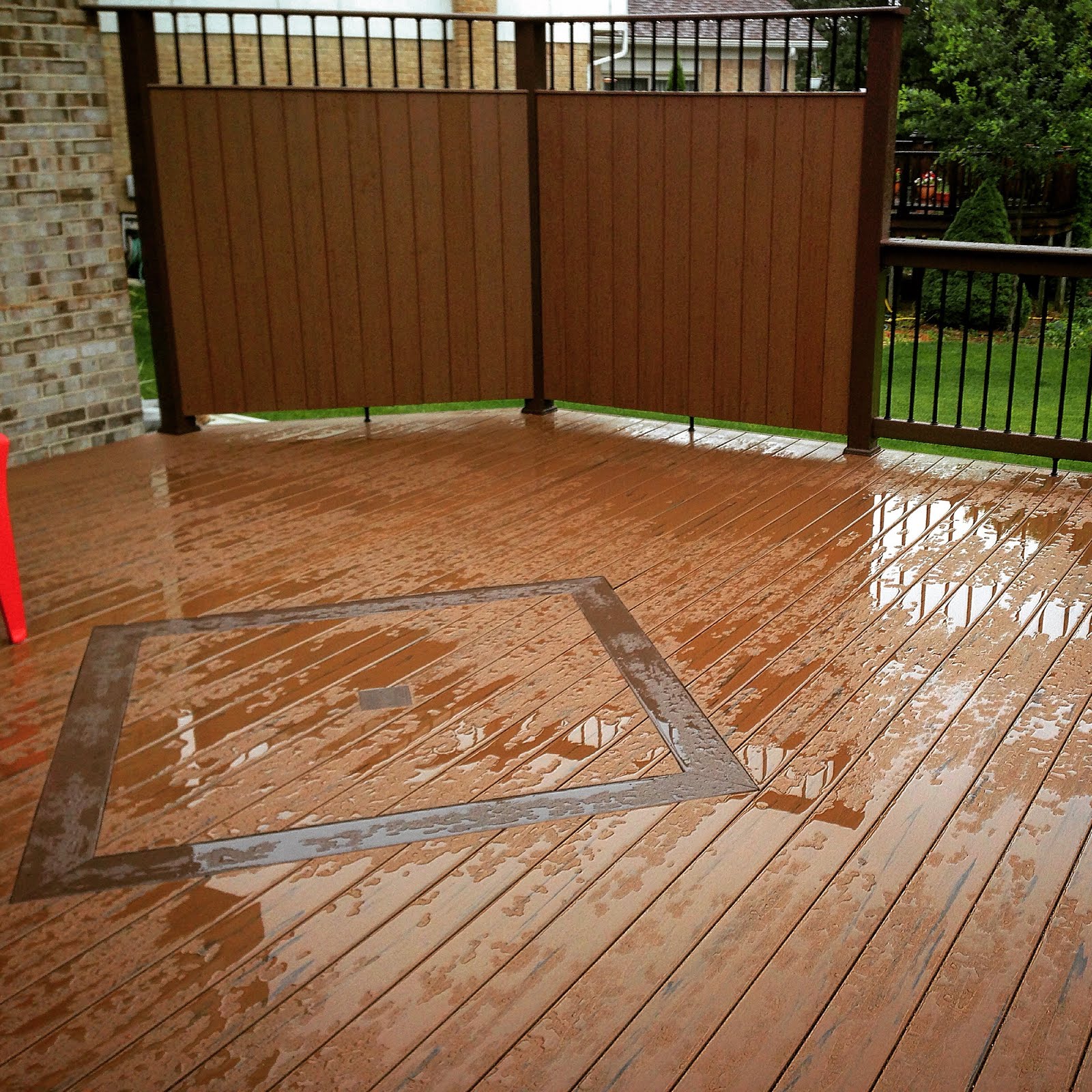 Outdoor Living: Low sloped roof decks, composite pavers and cable rail.