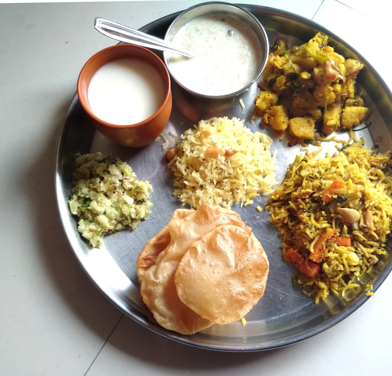 Maharashtrian thali lunch - sakhar bhaat, puri bhaji, masale bhaat ...