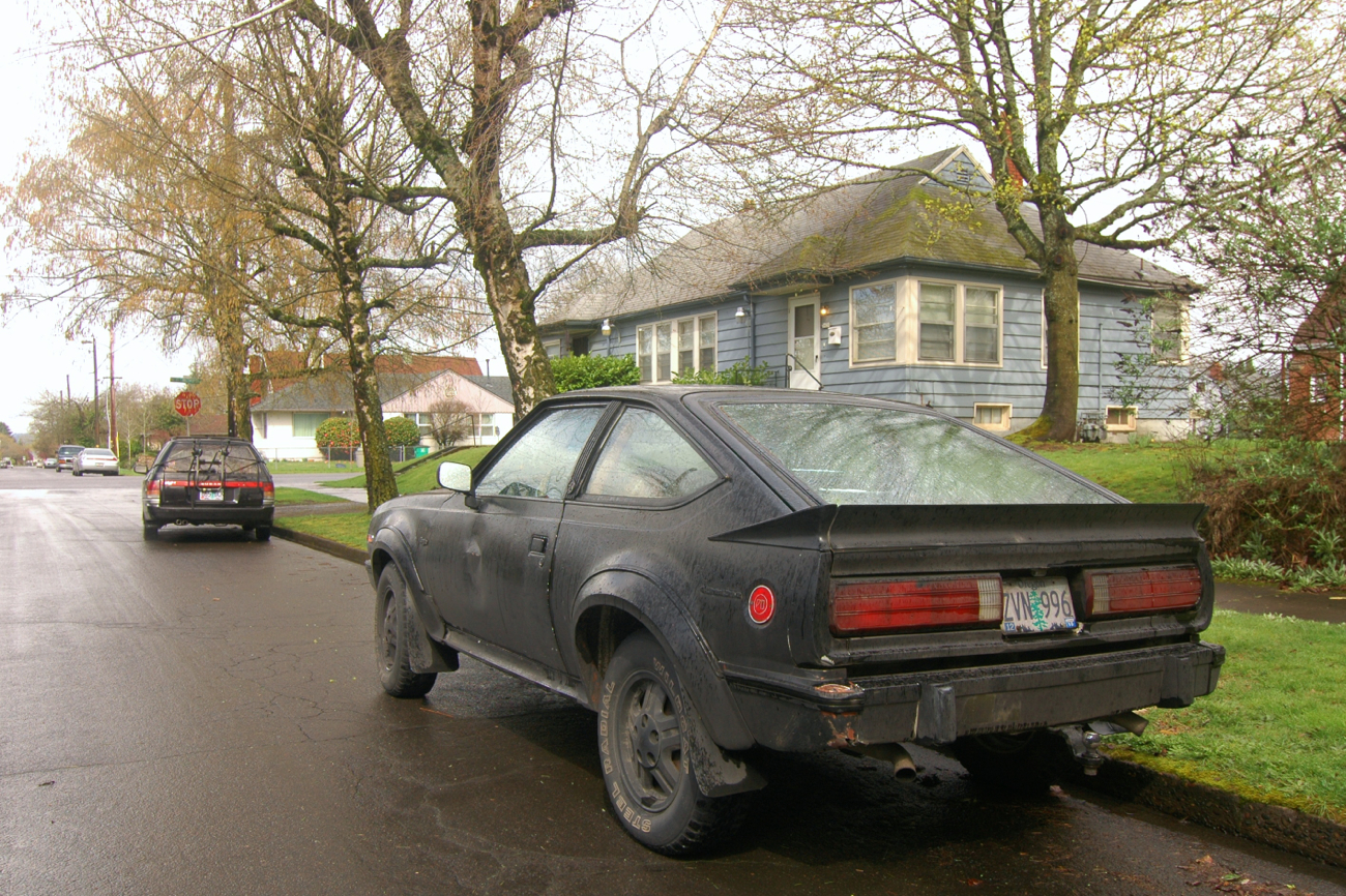 OLD PARKED CARS.: 1980 AMC Eagle SX4.