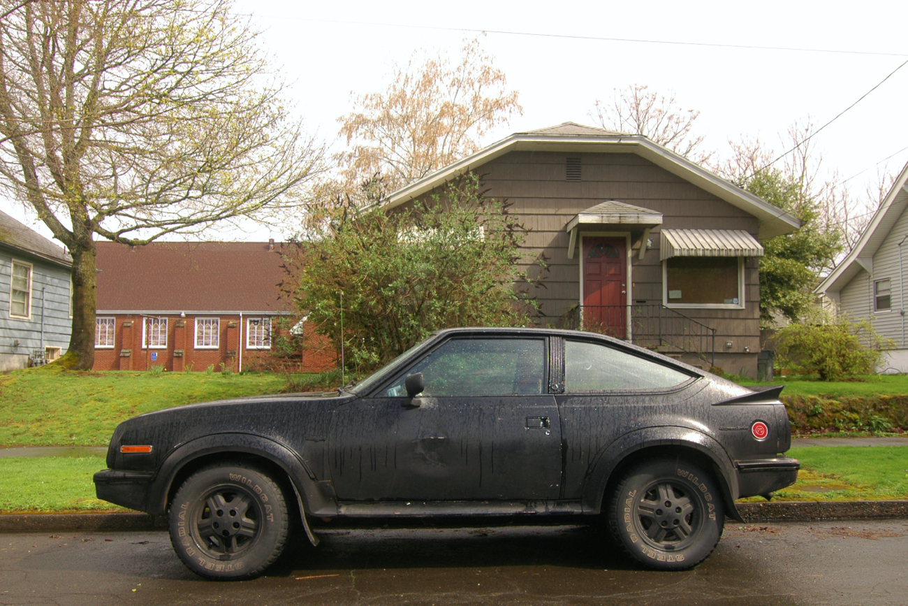 OLD PARKED CARS.: 1980 AMC Eagle SX4.