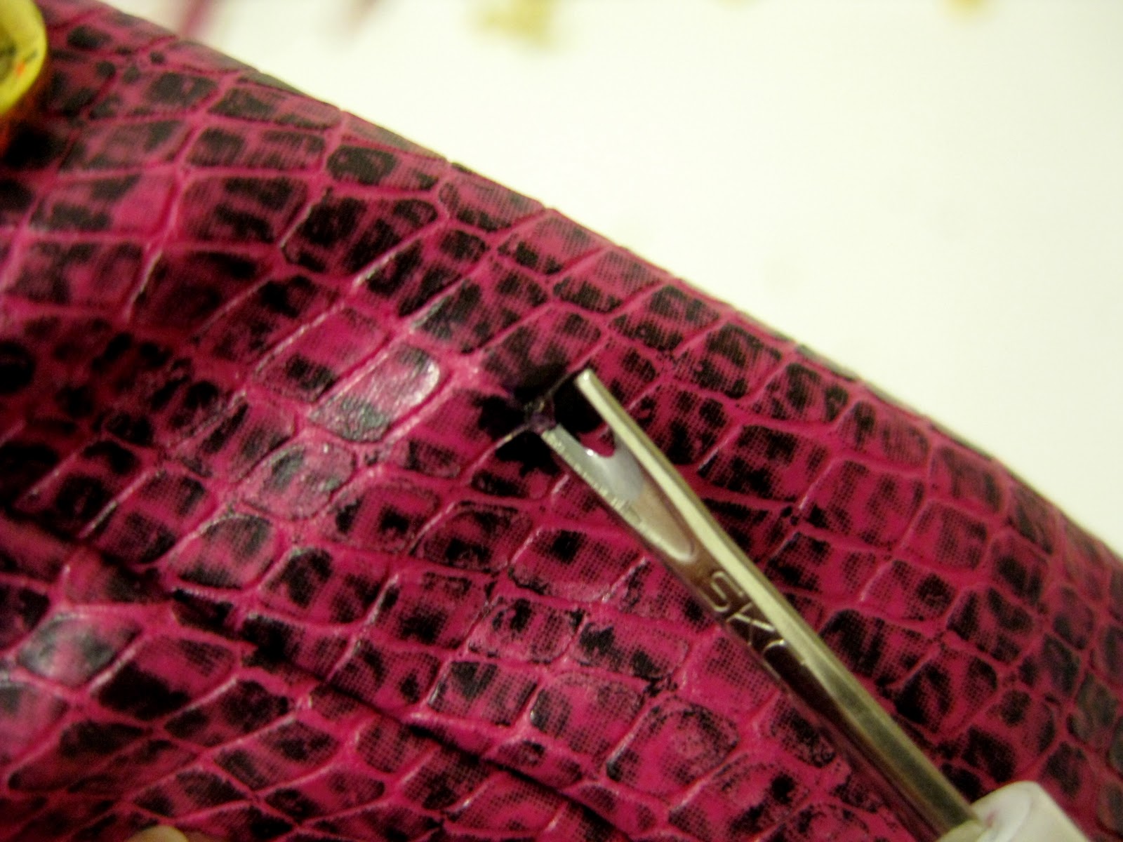 because she started knitting: DIY: Studded Snakeskin Clutch