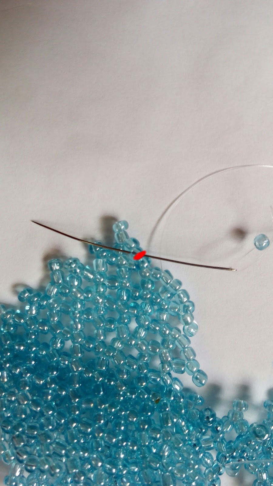 Beadination: Beautiful beaded flower using the bead netting technique.