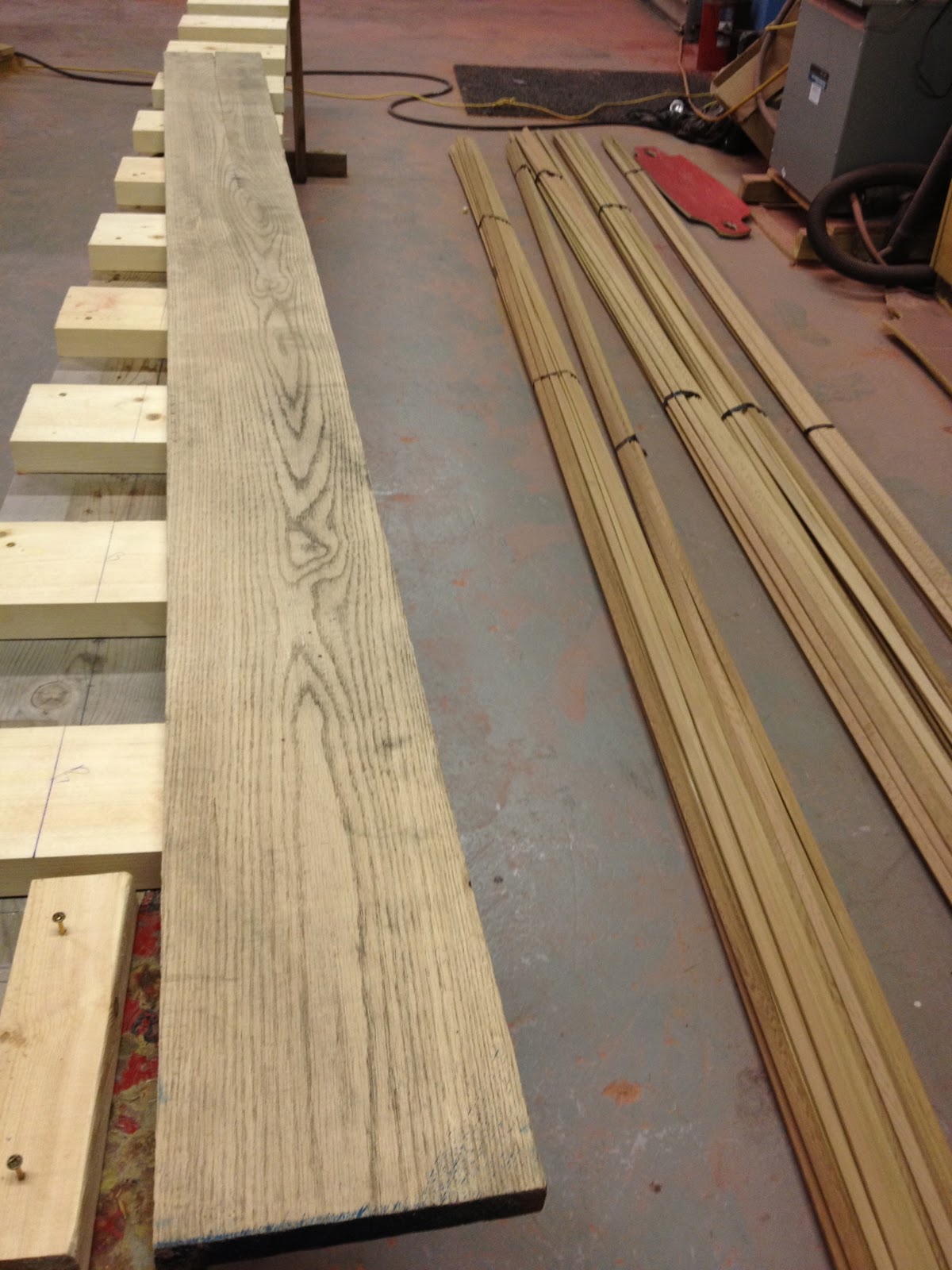 Building a cedar strip canoe: Setting up the form and the first strips.