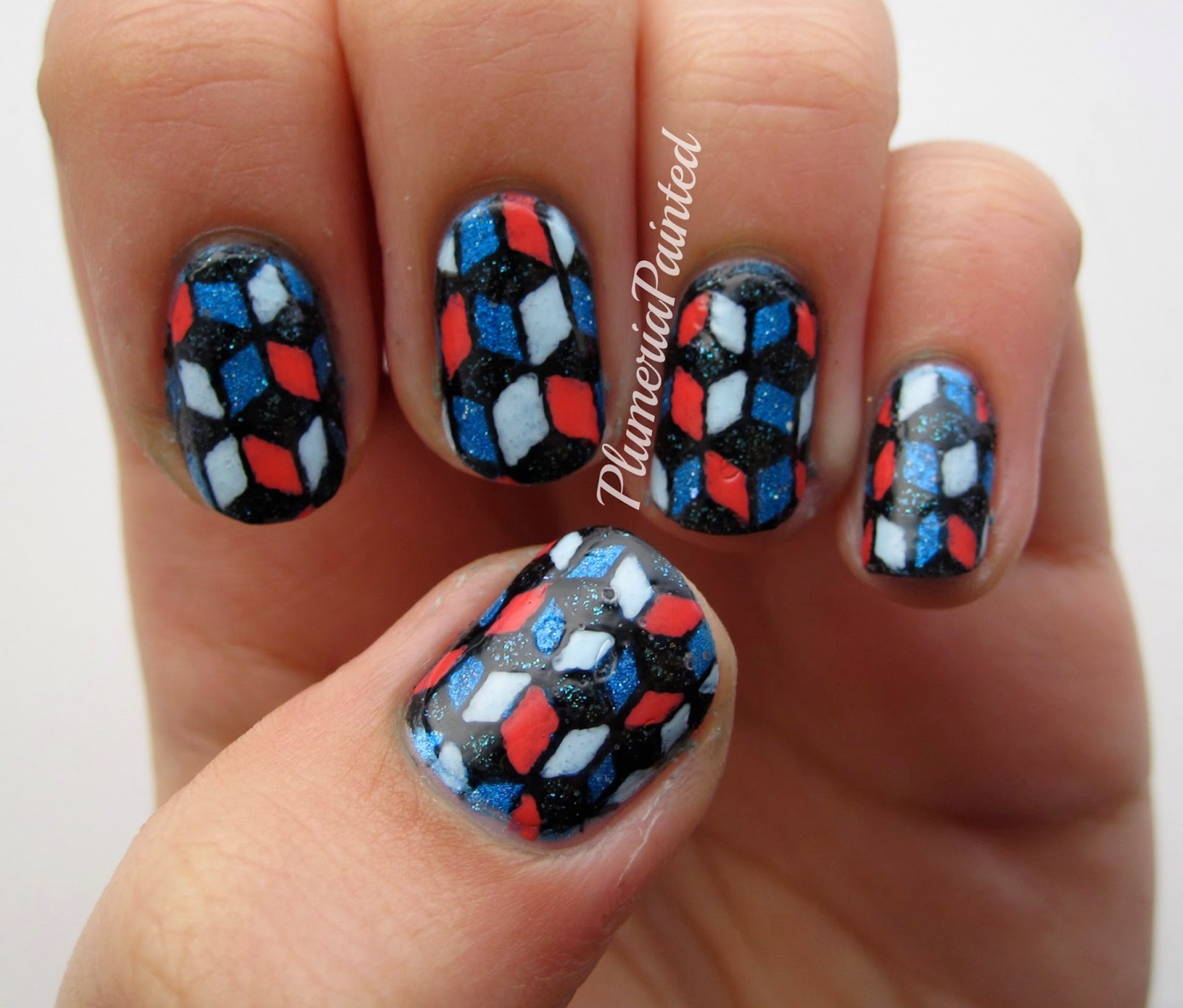 PlumeriaPainted: Red/blue/black 3D cube nails