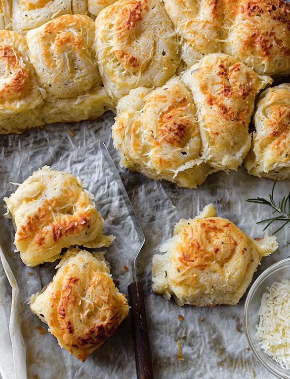 Light and fluffy dinner rolls are infused with fresh rosemary