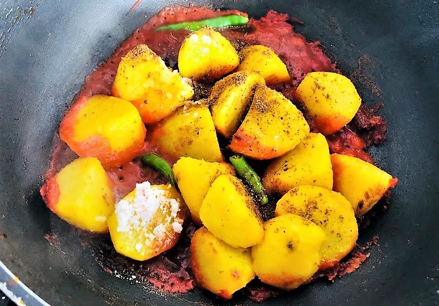 Dum Aloo ( Fried Potatoes tossed in spicy tomato gravy)
