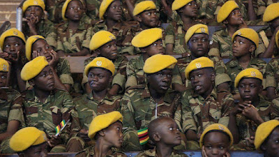 Young boys dress in the Zimbabwean National Army uniform in Harare to ...