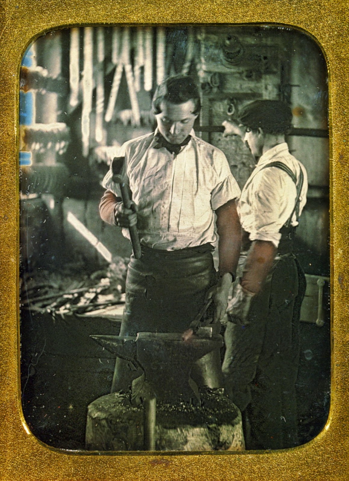 Hand-colored daguerreotype portrait of two blacksmiths at work, c. 1850 ...