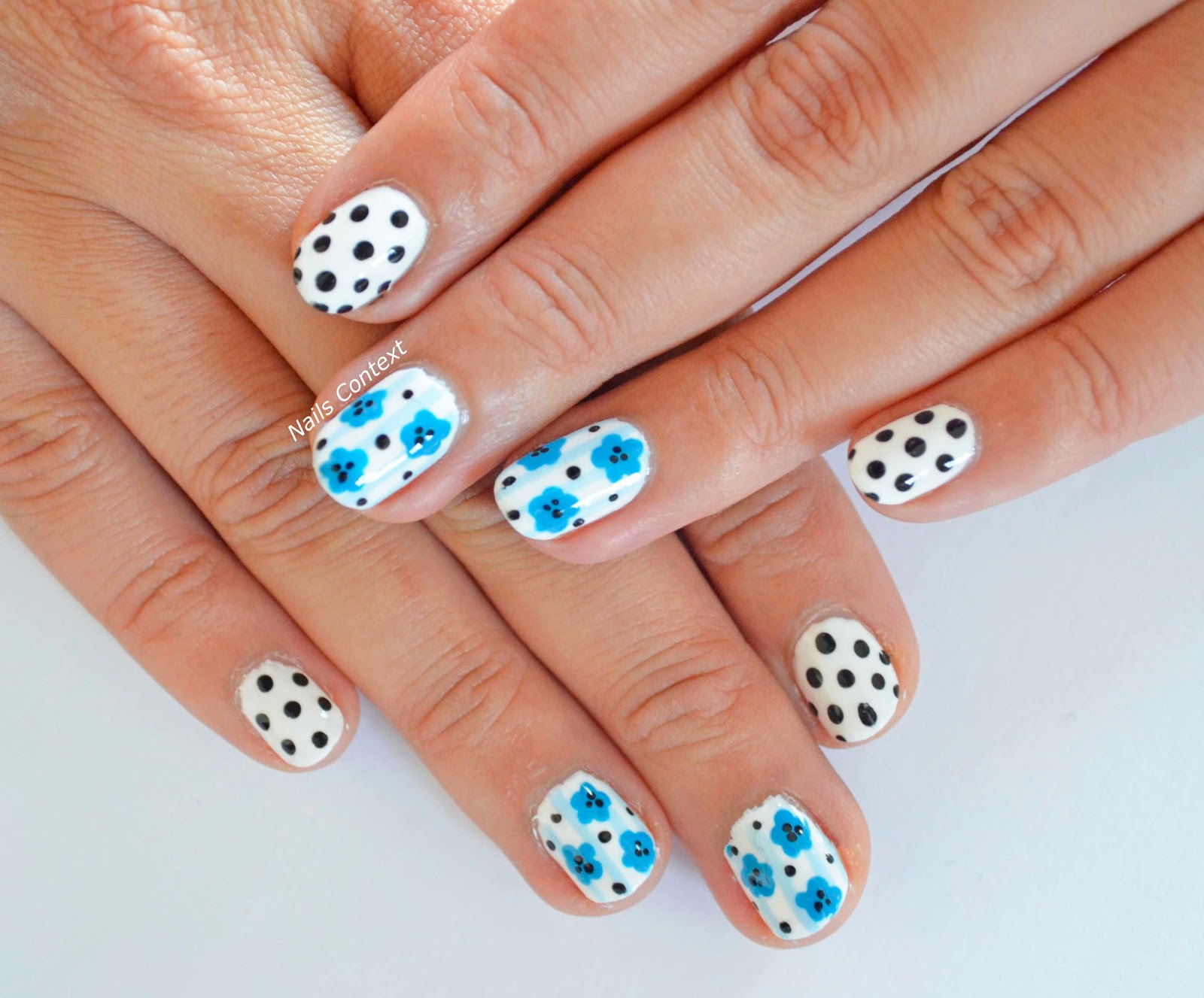 Nails Context: Blue spring flowers