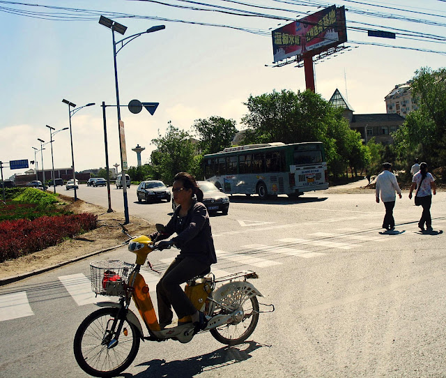 Stock Pictures: Streets of Beijing with people, traffic, cyclists ...