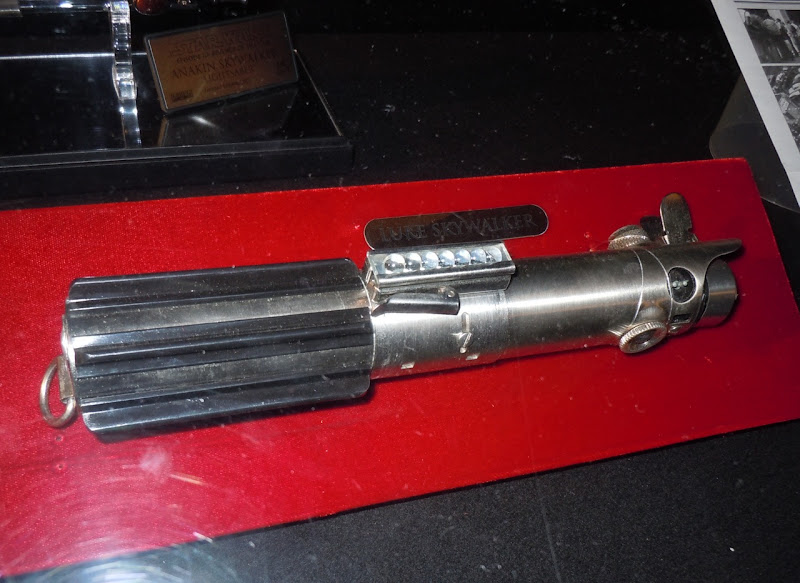 Lightsaber props from Star Wars on display... | Hollywood Movie Costumes