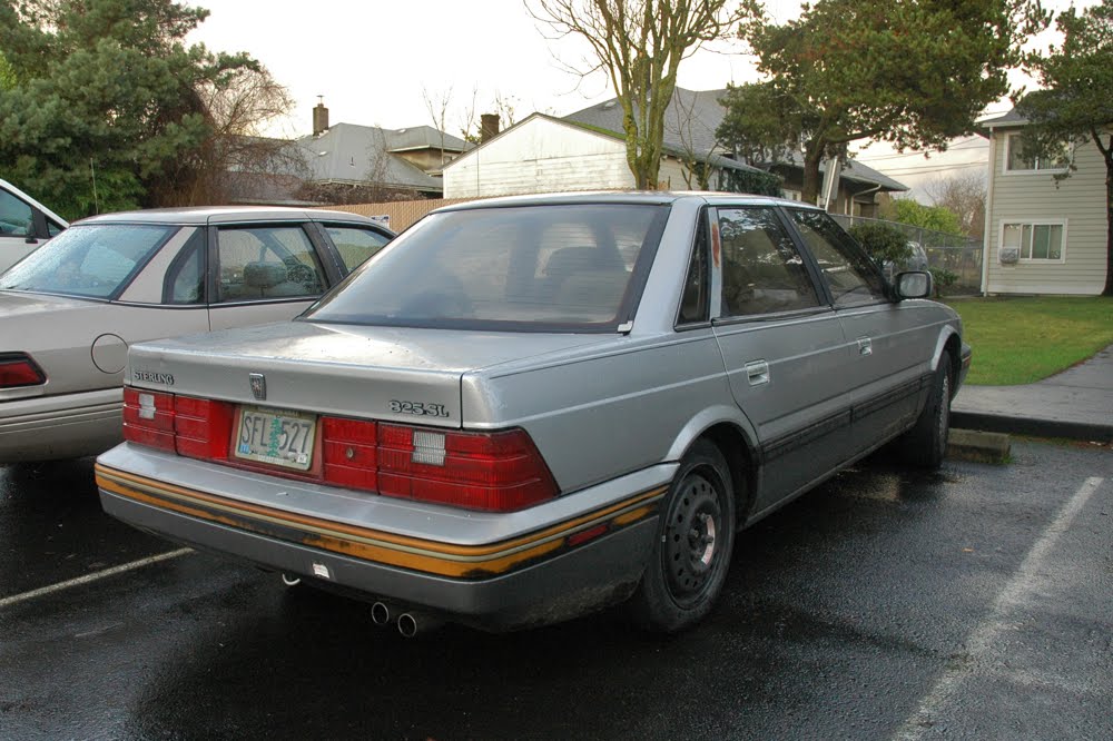 OLD PARKED CARS.: 1987 Sterling 825 SL.